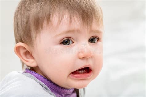 Baby Girl Making A Funny Face Showing Growing Teeth Stock Image Image