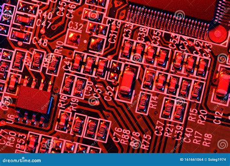 Printed Circuit Board And Microchip Or Cpu In Red Light Closeup Electronic Component For