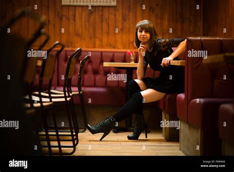 A Seductive Long Legged Young Woman Girl Model Wearing A Short Skirt