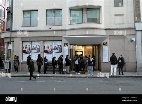People Queueing Up Standing Outside The Canada Visa Application Centre