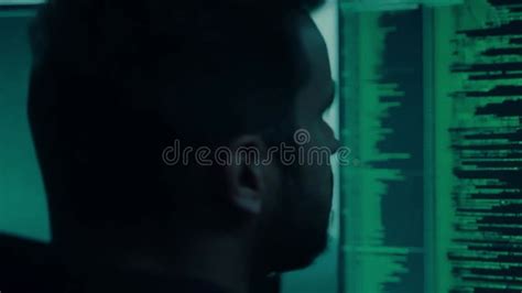 Focused Programmer Coding In A Dimly Lit Workspace Stock Footage Video Of Digital