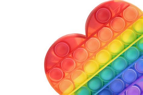 다채로운 안티 스트레스 팝 그것 장난감 흰색 배경에 고립 된 무지개 감각 만지작 거리는 하드 그림자 새로운 트렌디 한 실리콘 장난감 손가락의 미세 한 모터 기술의 개발을위한