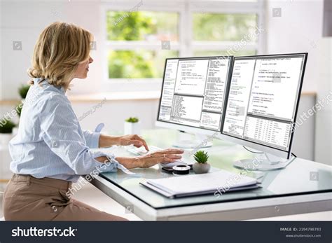 Programmer Woman Coding On Multiple Computer Stock Photo Shutterstock