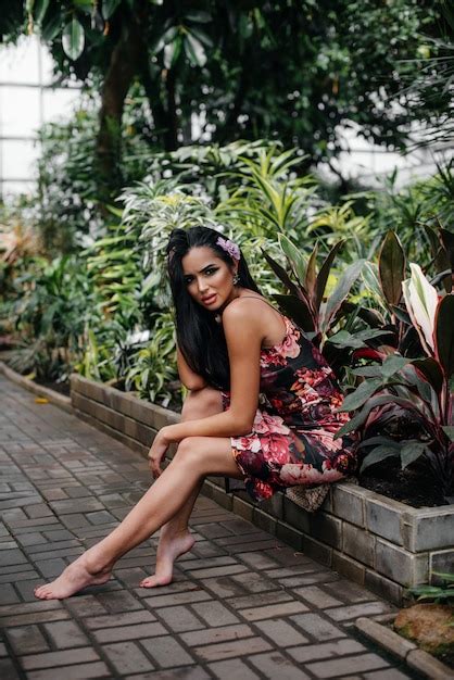 Premium Photo A Young Beautiful Brunette Posing Among Dense Thickets