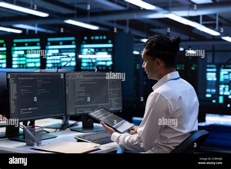 Computer Scientist Doing Yearly Checkup To Prolong Data Center