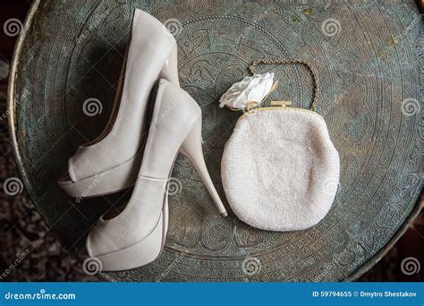 Wedding Women S Shoes And Clutch On Brass Tray With An Ornament Stock