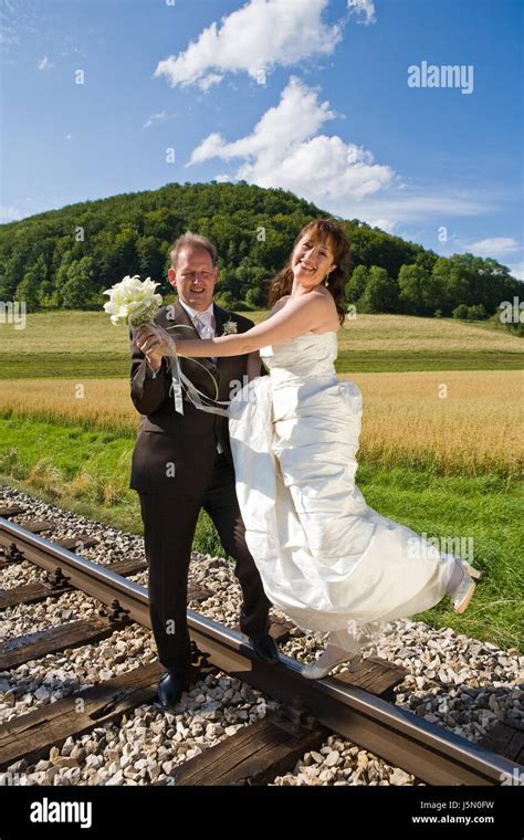 Bridal Couple On Rails Stock Photo Alamy