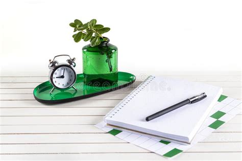 Home Office Workspace Mockup With Notebook Pen Alarm Clock Plant