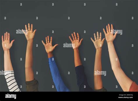 Raise Your Hand If Youre Part Of Our Team A Group Unrecognizable People Holding Up Their Hands