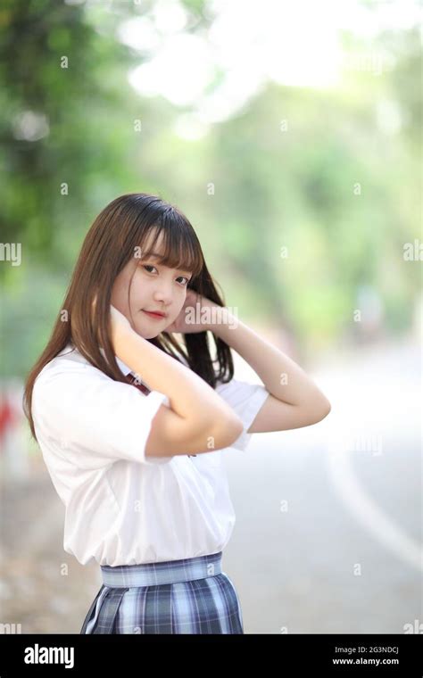 Beautiful Asian Japanese School Girl Uniform Looking At Park Outdoor