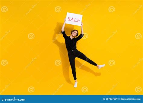 Full Body Photo Of Nice Millennial Lady Hold Poster Sale Wear Shirt Jeans Boots Isolated On