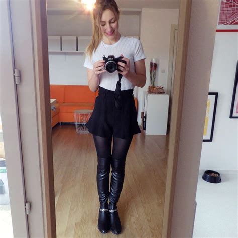 Mirror Selfie Of Black Thigh High Boots On Black Pantyhose With Short Miniskirt
