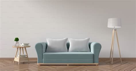 거실에는 파란색 소파 베개 램프 책이 있으며 배경 벽에는 꽃병이 비어 있습니다 3d 렌더링 사진 Unsplash의 텅 빈 벽 이미지