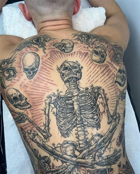 27 Bold And Edgy Back Tattoos For Men
