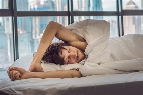 Premium Photo Man Wakes Up In The Morning In An Apartment In The