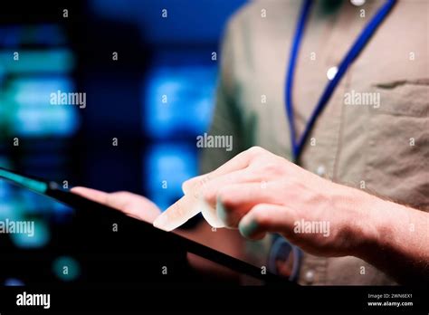 Technician Doing Monitoring In Server Farm Responsible With Intense Data Computations Demanding