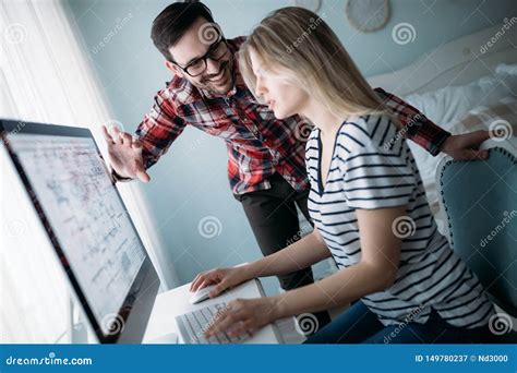 Young Attractive Designers Working On Project Together Stock Image Image Of Freelance