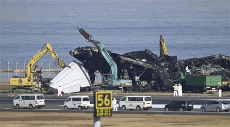 Plane Wreckage Being Cleared From Tokyo Airport After Collision