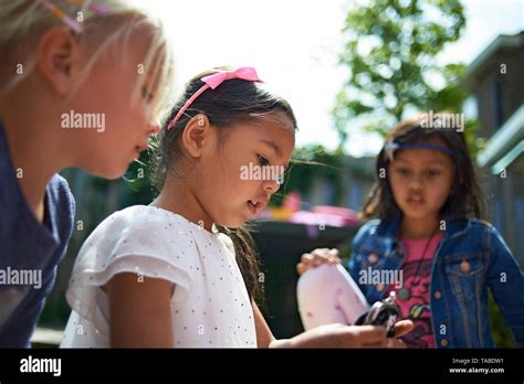 Beautiful Colorful Image Of A Young Preteen Asian Girls Surrounded By