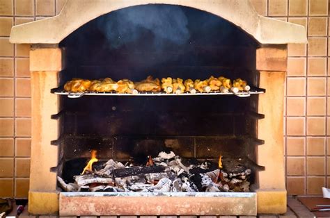 Premium Photo View Of Barbeque Inside A Brick Griller