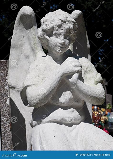 White Plaster Angel As Guardian Of The Grave In The Cemetery Stock