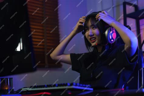 premium photo female cyber hacker gamer in headphone confused while