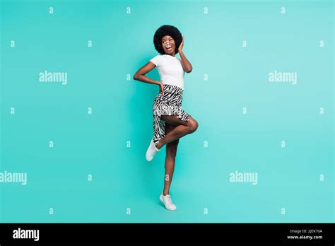 Photo Of Funny Impressed Dark Skin Lady Wear Casual Clothes Smiling