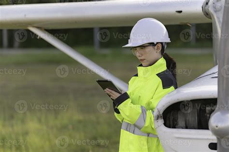 Technician Fixing The Engine Of The Airplane Female Aerospace Engineering Checking Aircraft