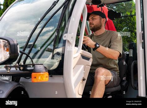 Man Worker Is Operating The Agri Farmer Rotating Telescopic Handler Sitting In Cabin Of Tele