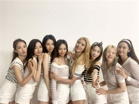 Download Girls Generation Group Photoin Whiteand Stripes Wallpaper