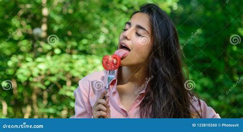 Seductive Appetite Woman Full Of Desire Eating Tomato Girl Holds Fork