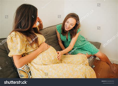 Two Pregnant Women Giving Birth In Bedroom