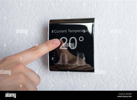Touching Digital Thermostat Stock Photo Alamy