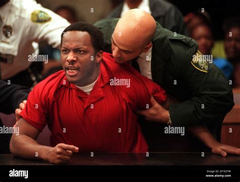 Labrant Dennis Lost His Temper And Had To Be Restrained As He Listened