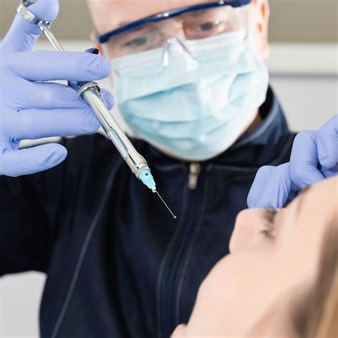 Premium Photo Patient Receiving Dental Anesthetic