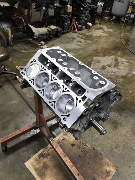 An Engine Block On A Stand In A Garage