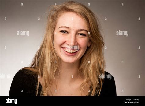 A Young Blonde 19 Year Old Teenage Girl Looking Happy Smiling Positive