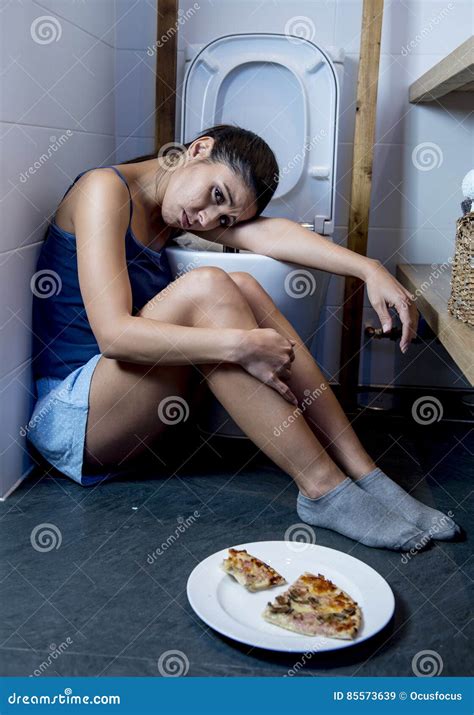 Young Sad And Depressed Bulimic Woman Feeling Sick Guilty After