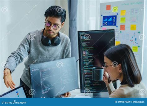 Asian And Indian Developer Team Discussion Feedback Analysis Coding Data With Software Computer
