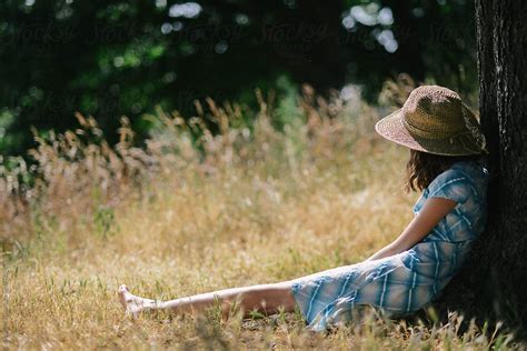Girl Sitting Against A Tree By Stocksy Contributor Kirstin Mckee Stocksy