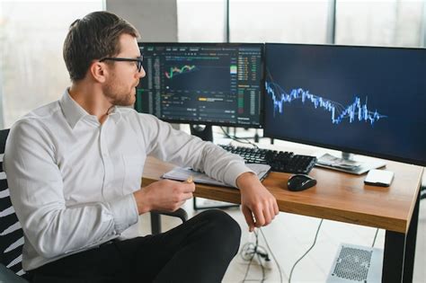 Premium Photo Serious Business Man Trader Analyst Looking At Computer Monitor Investor Broker