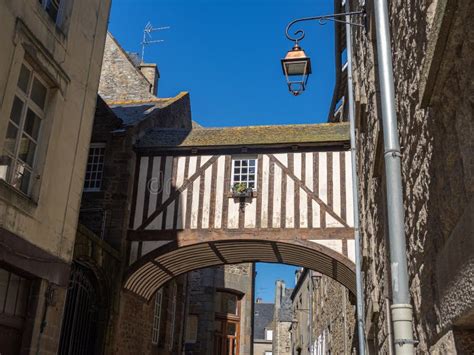 Half Timbered Bridge House Over A Narrow Medieval Street In Saint Malo