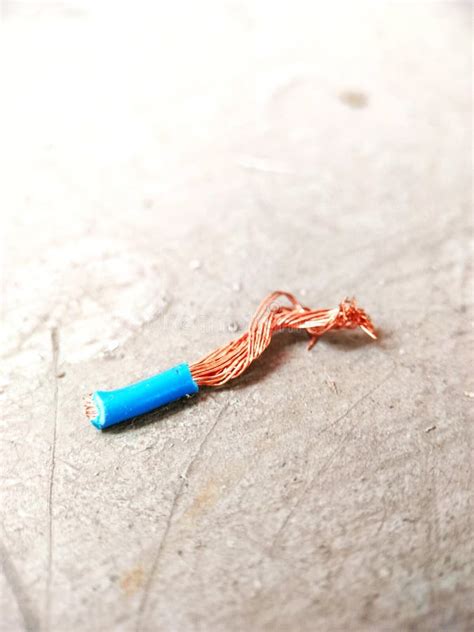Piece Of Electric Wired Cable Wrapped In Blue Plastic Isolated With