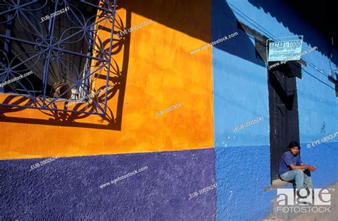 Part View Of Building Painted In Rectangles Of Ochre Blue And Purple