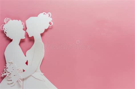 Paper Art Of Two Brides In Wedding Dresses Surrounded By Pink Hearts