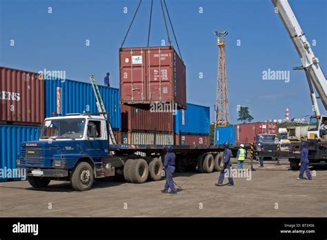 Luba Oil Freeport Stevedores Unloading And Stacking Containers From Truck Before Loading Onto