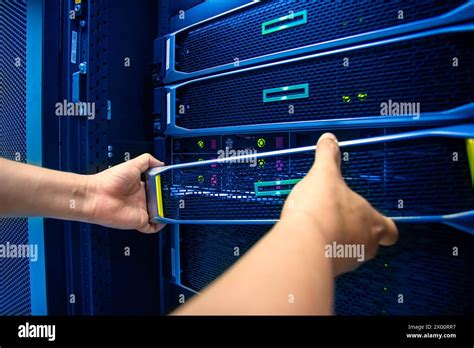 Man Fixing Server In Data Center Room Stock Photo Alamy