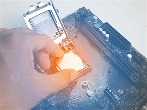 Hold The CPU Handle And Insert It Into The CPU Slot On The Motherboard It S An Old Motherboard
