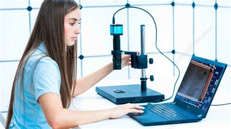 Scientist Testing Microelectronic Device Stock Image F041 9461 Science Photo Library