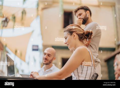 Successful Outcomes In Business Young Businesspeople Discussing Strategy And Analyzing